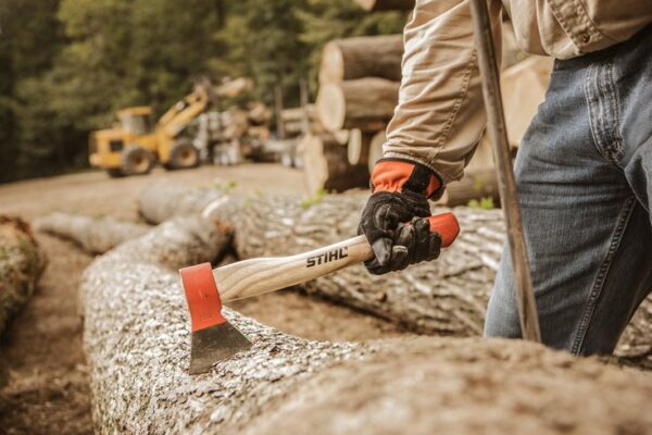 Lop off tree limbs for kindling with the Stihl woodcutter/forestry ...